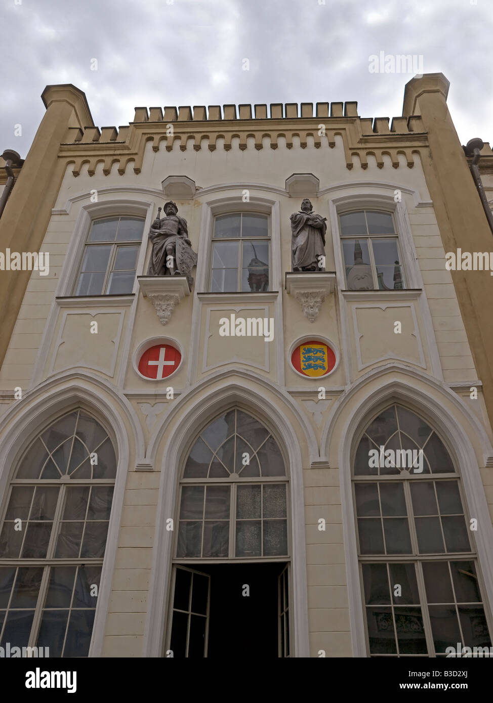 statues of knight and arms of the town Tallinn on facade of a house in ...