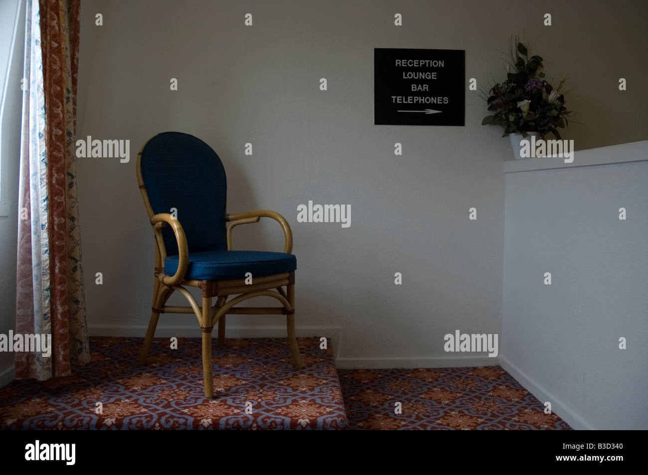 Chair on a hotel landing Stock Photo - Alamy