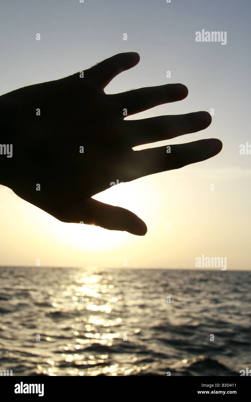Backlit silhouette arm dark figure secret shore hi-res stock ...