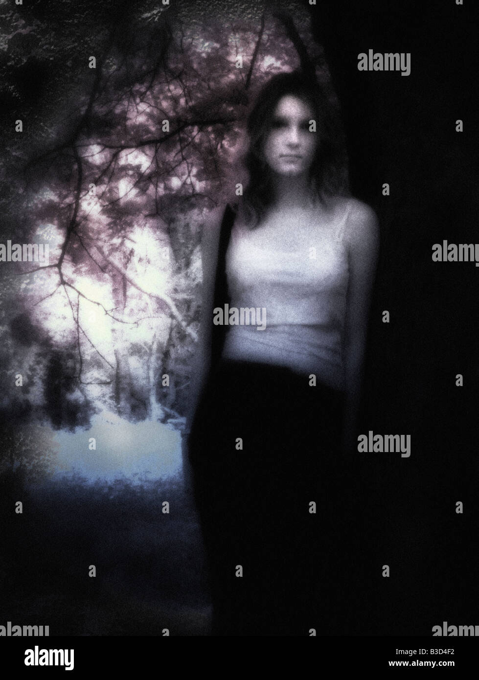 Dark Young Woman staring at the observer Stock Photo - Alamy