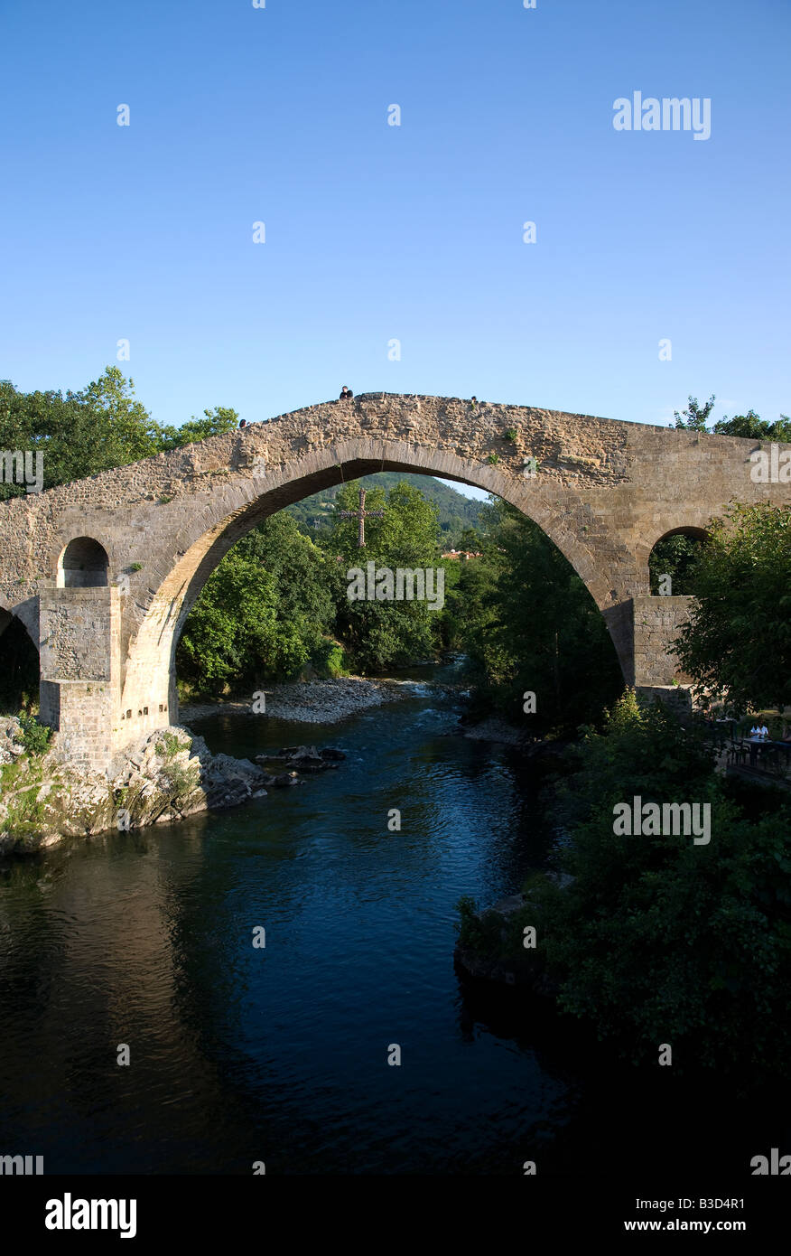 The medieval Puente Romano bridge in the town of Cangas de Onis in the ...