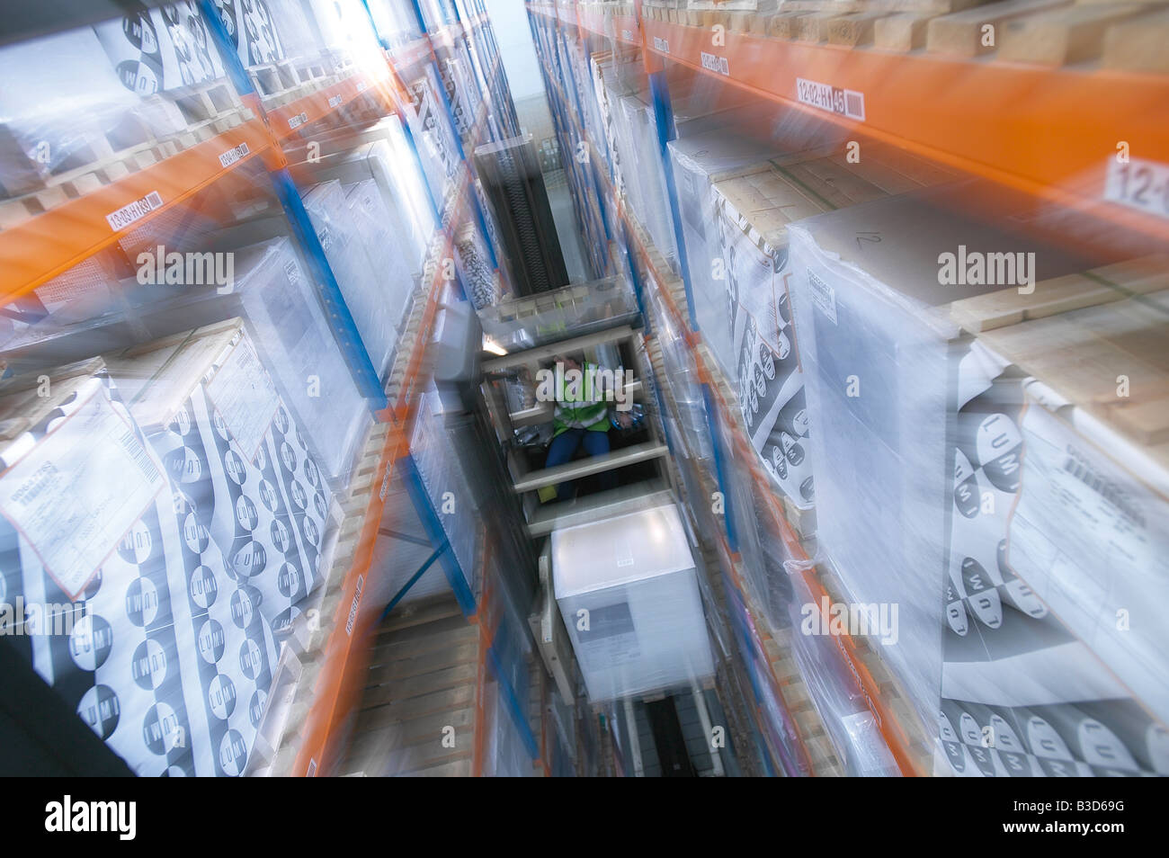 fork lift truck handling packaging in a warehouse Stock Photo - Alamy