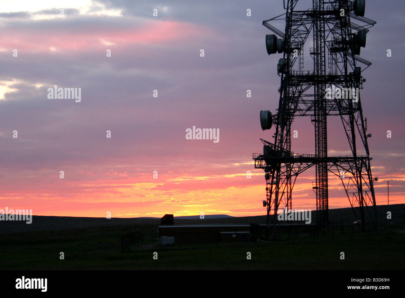 Communications tower at sunset Stock Photo - Alamy