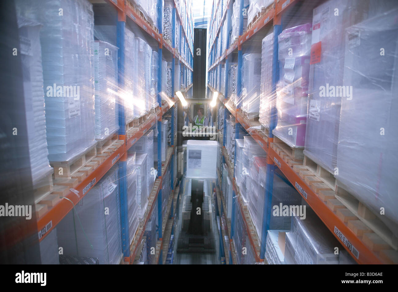 fork lift truck handling packaging in a warehouse Stock Photo - Alamy