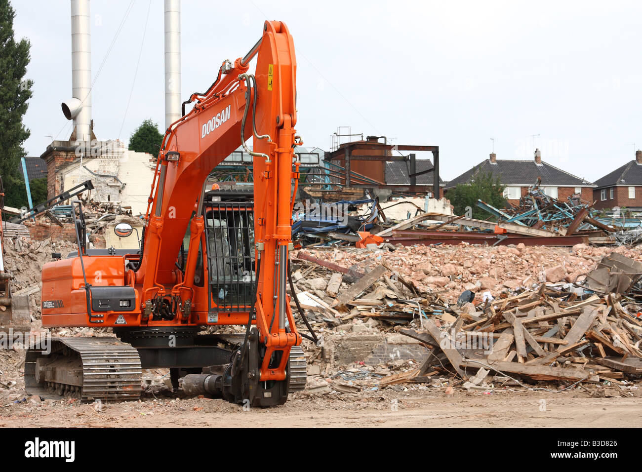 A caterpillar tracked earthmover on a demolition site Stock Photo - Alamy