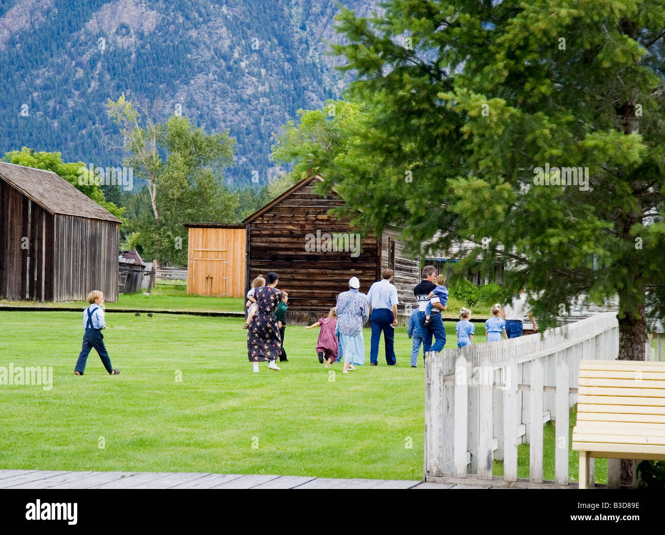 extended family in a rural scenery - between cottages and a fence Stock ...