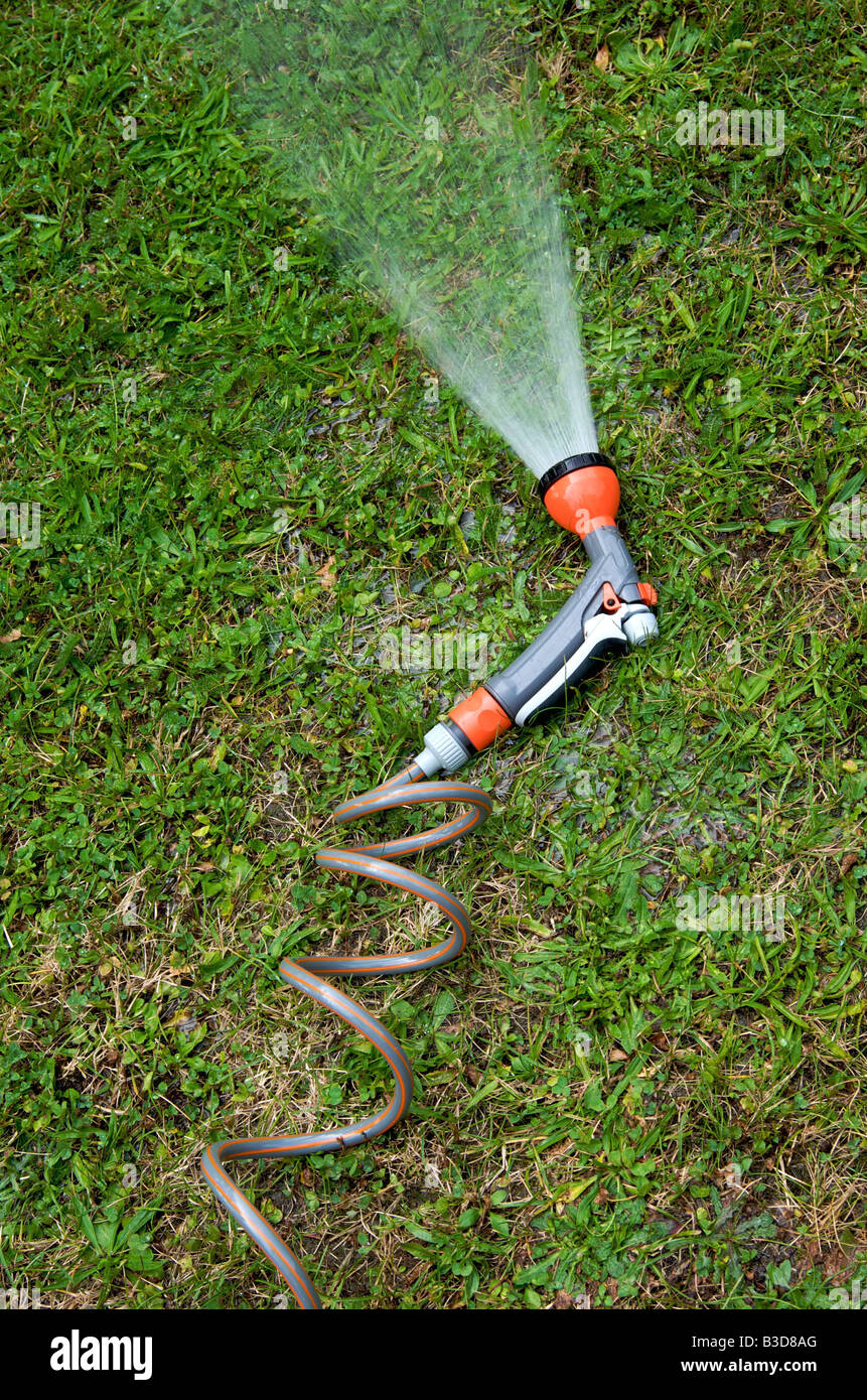 Hosepipe watering spray gardening hi-res stock photography and images ...