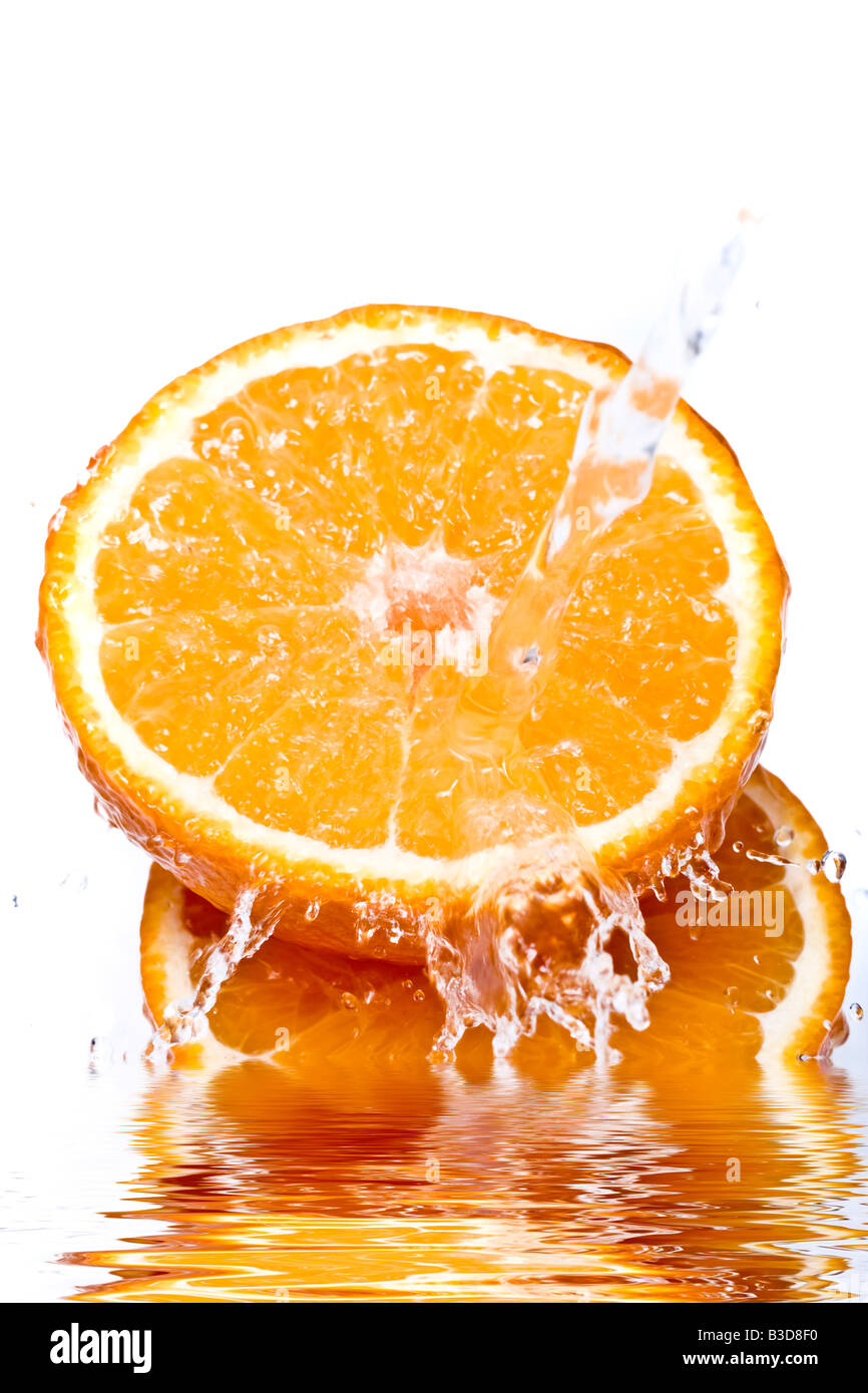 Water splashing down on an orange with reflection Stock Photo - Alamy