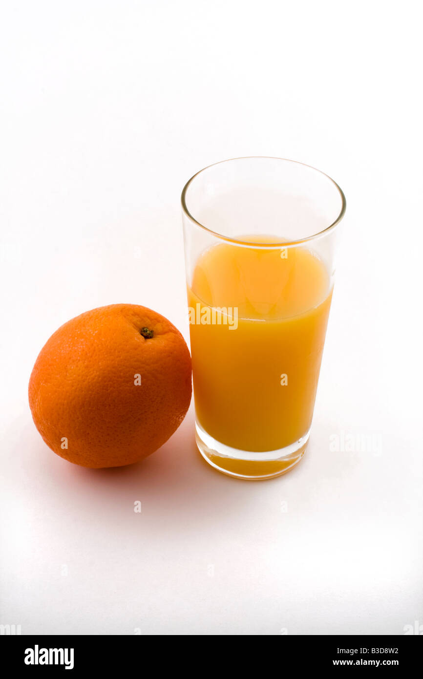 A glass of orange juice and its source Stock Photo - Alamy