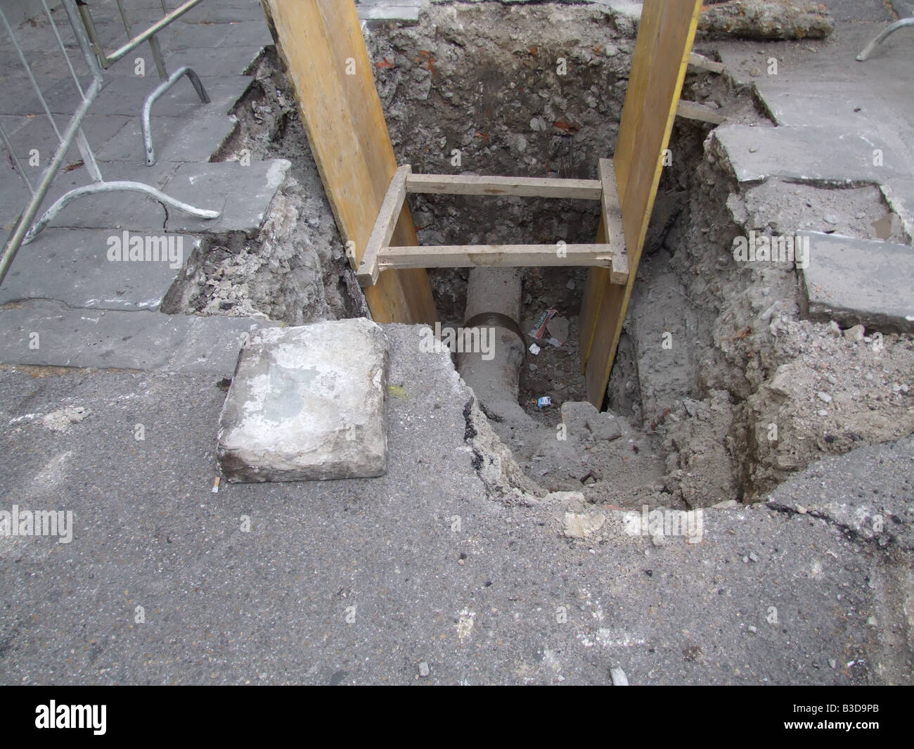 repair work in hole in street in city town Stock Photo - Alamy