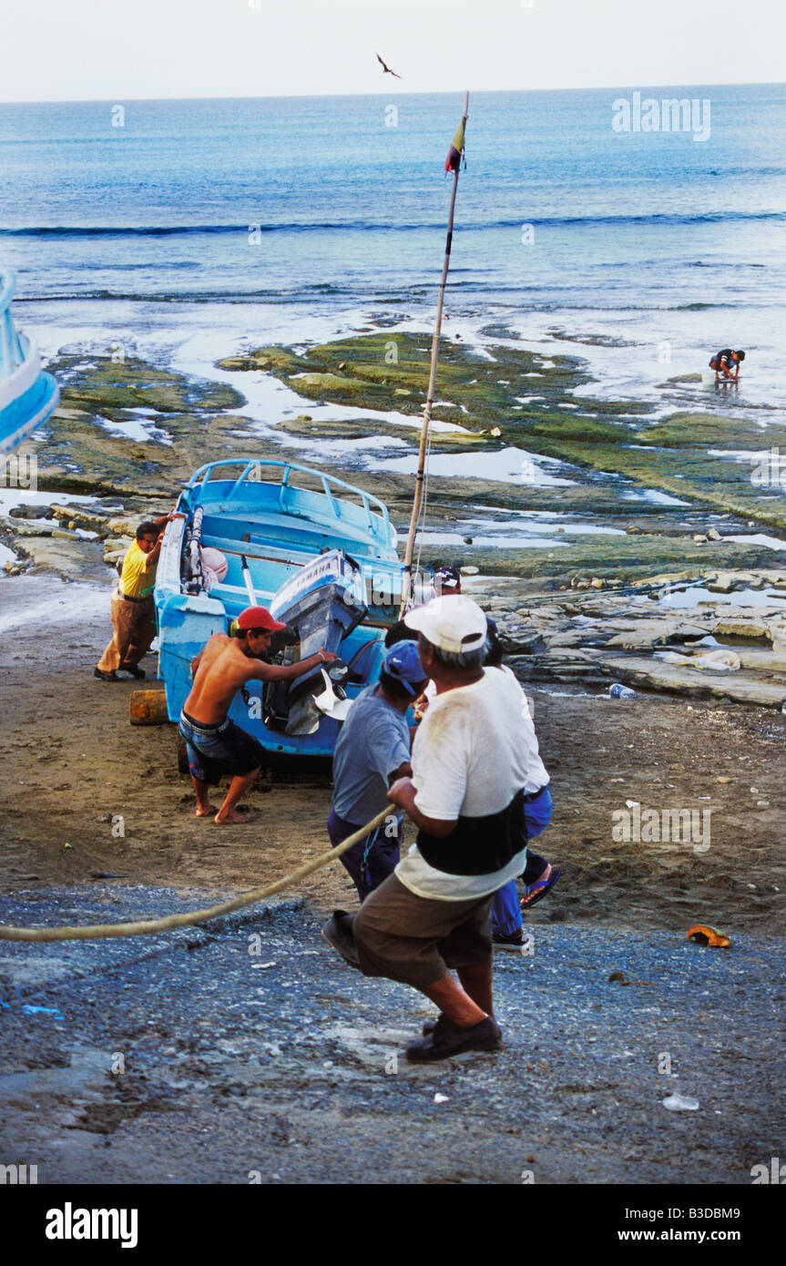 Local men from village help pull fishing boat from Pacific Ocean in San ...