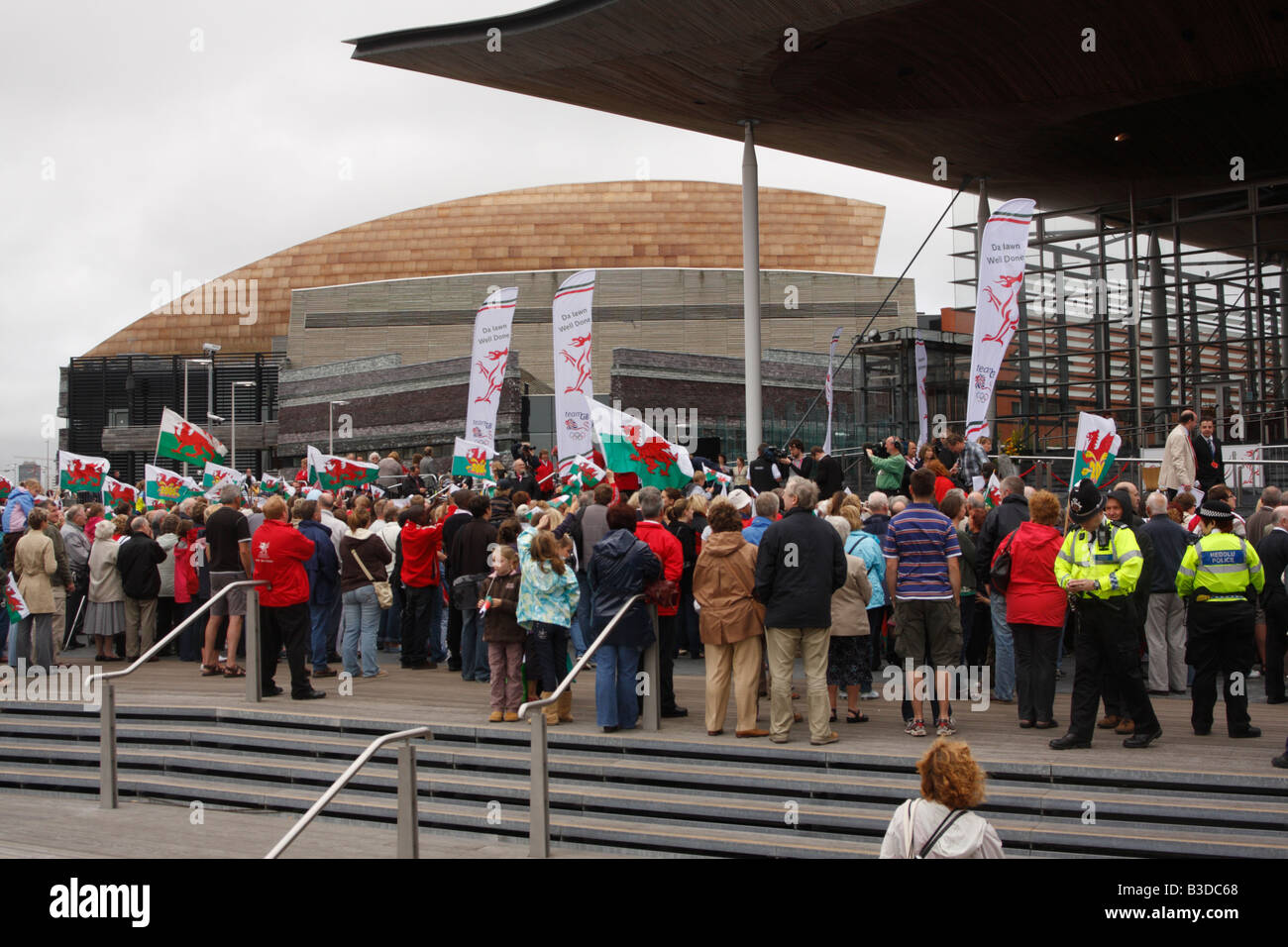 Crowd gathers at the Senedd, Cardiff Bay, to welcome home Welsh Olympic ...