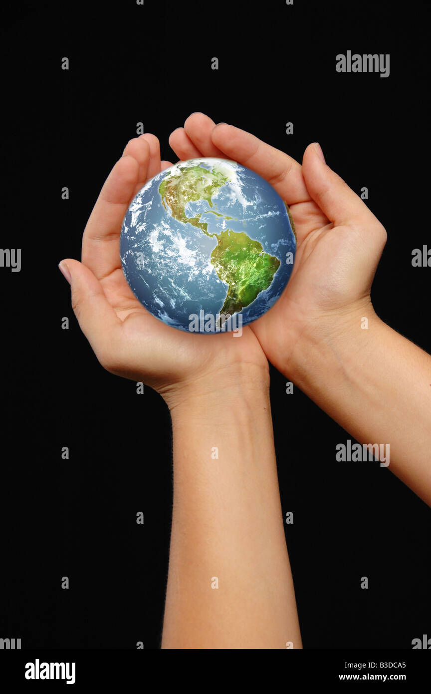 Hands holding the world on a black background Stock Photo - Alamy