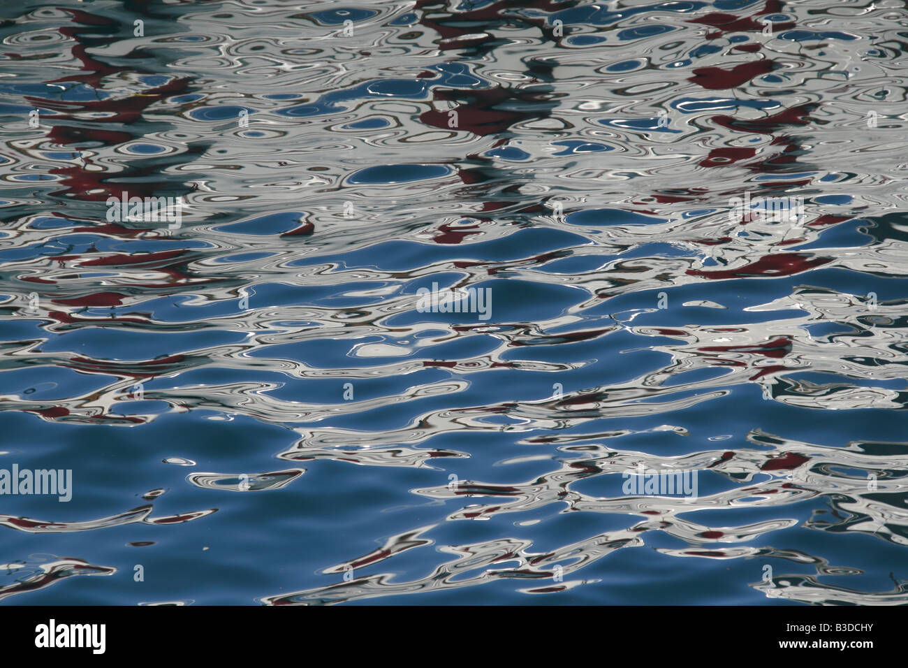 boat pattern reflection on water ripples in sea Stock Photo - Alamy
