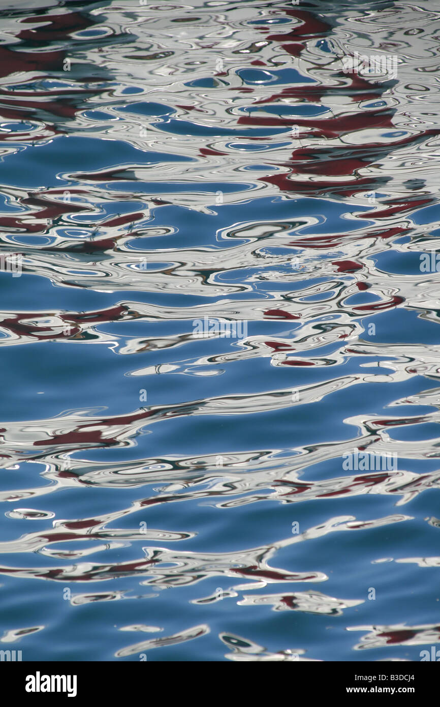 boat pattern reflection on water ripples in sea Stock Photo - Alamy