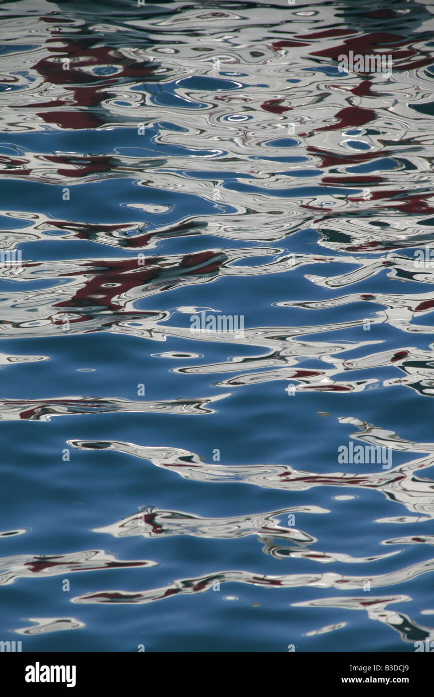 boat pattern reflection on water ripples in sea Stock Photo - Alamy