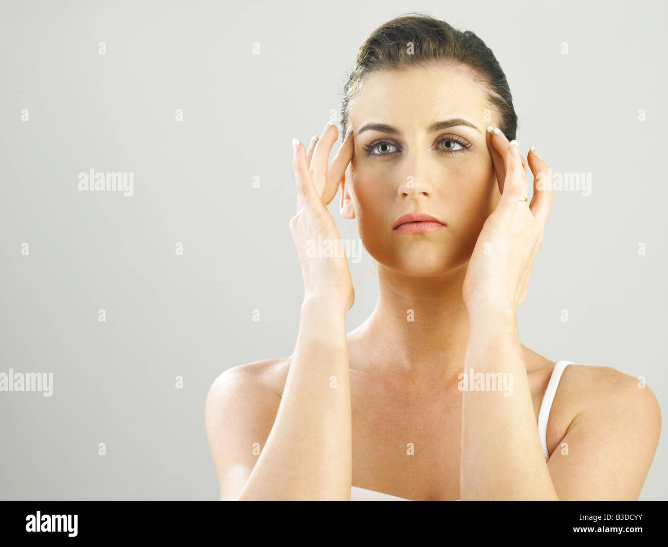 Woman with Hands on Head Stock Photo - Alamy