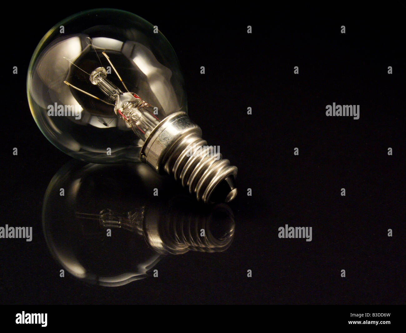Light Bulb Reflected on Black Background Stock Photo - Alamy