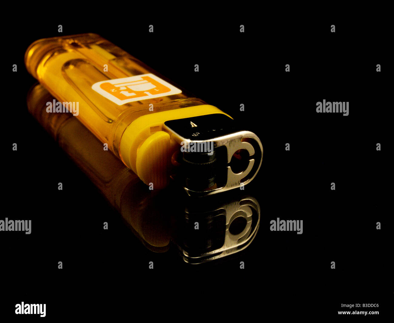 Yellow Disposable Cigarette Lighter Reflected on Black Background Stock ...