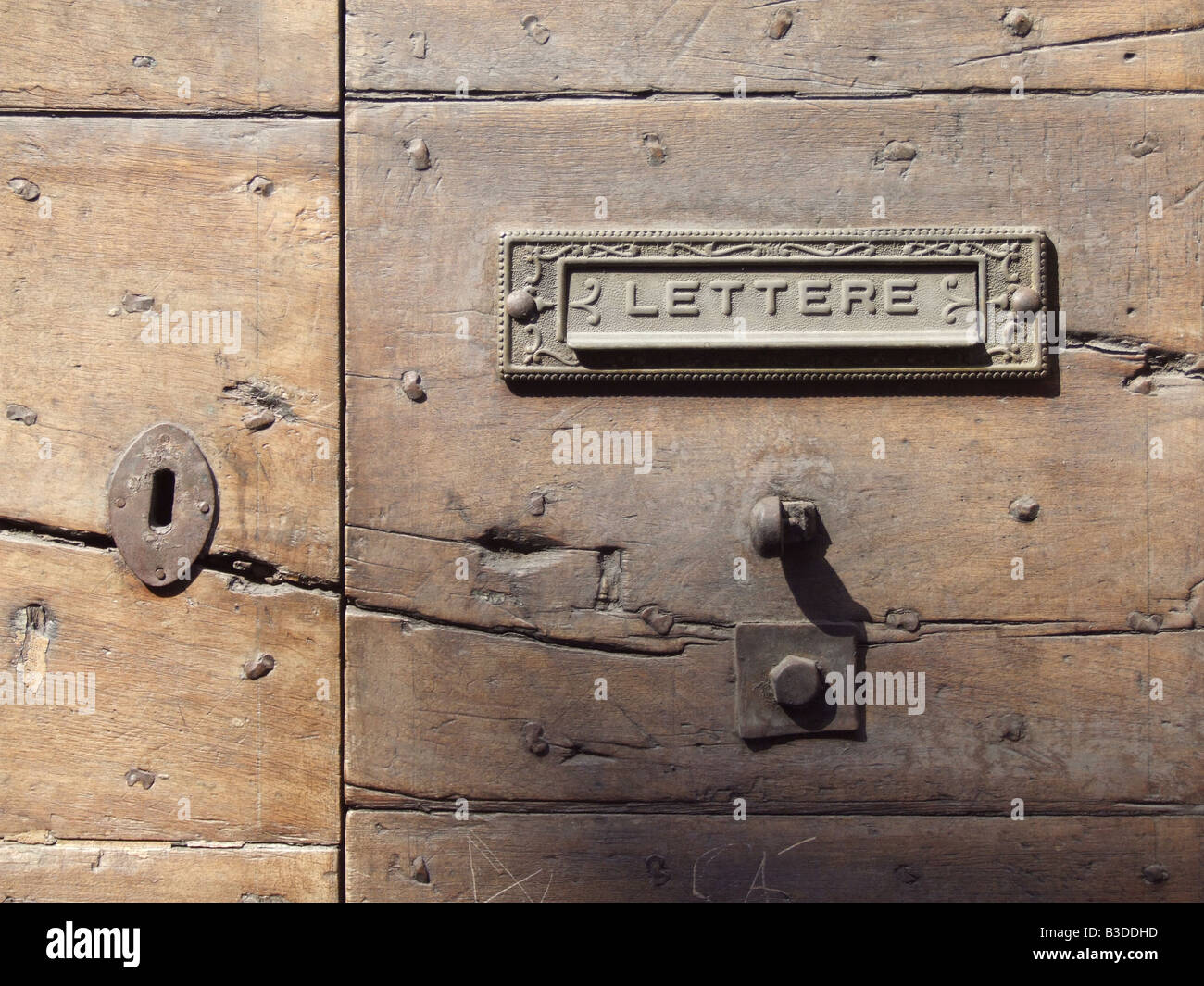 italian letter box and old wooden door Stock Photo - Alamy