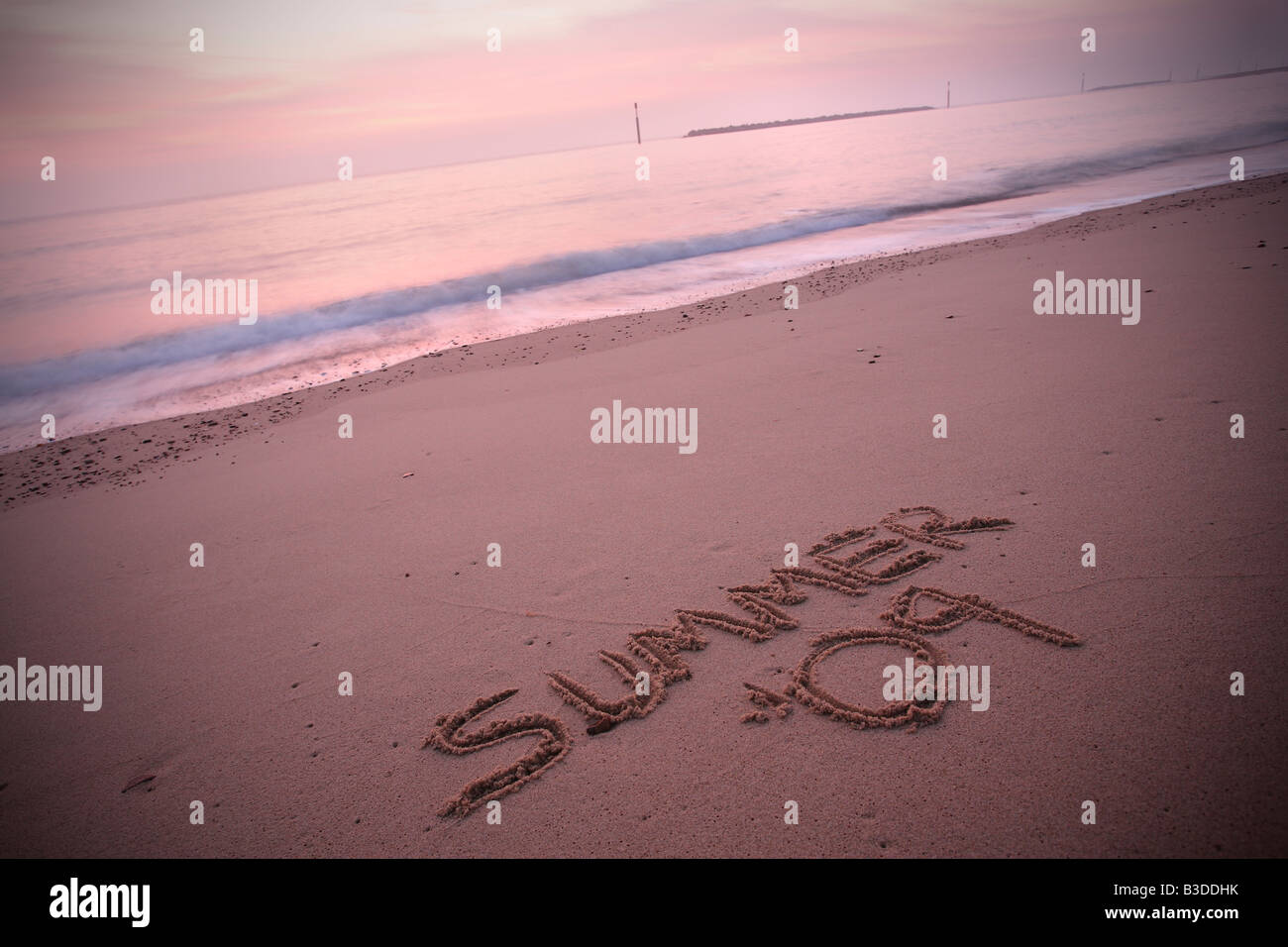 Beach image with Summer '09 written in the sand Stock Photo - Alamy