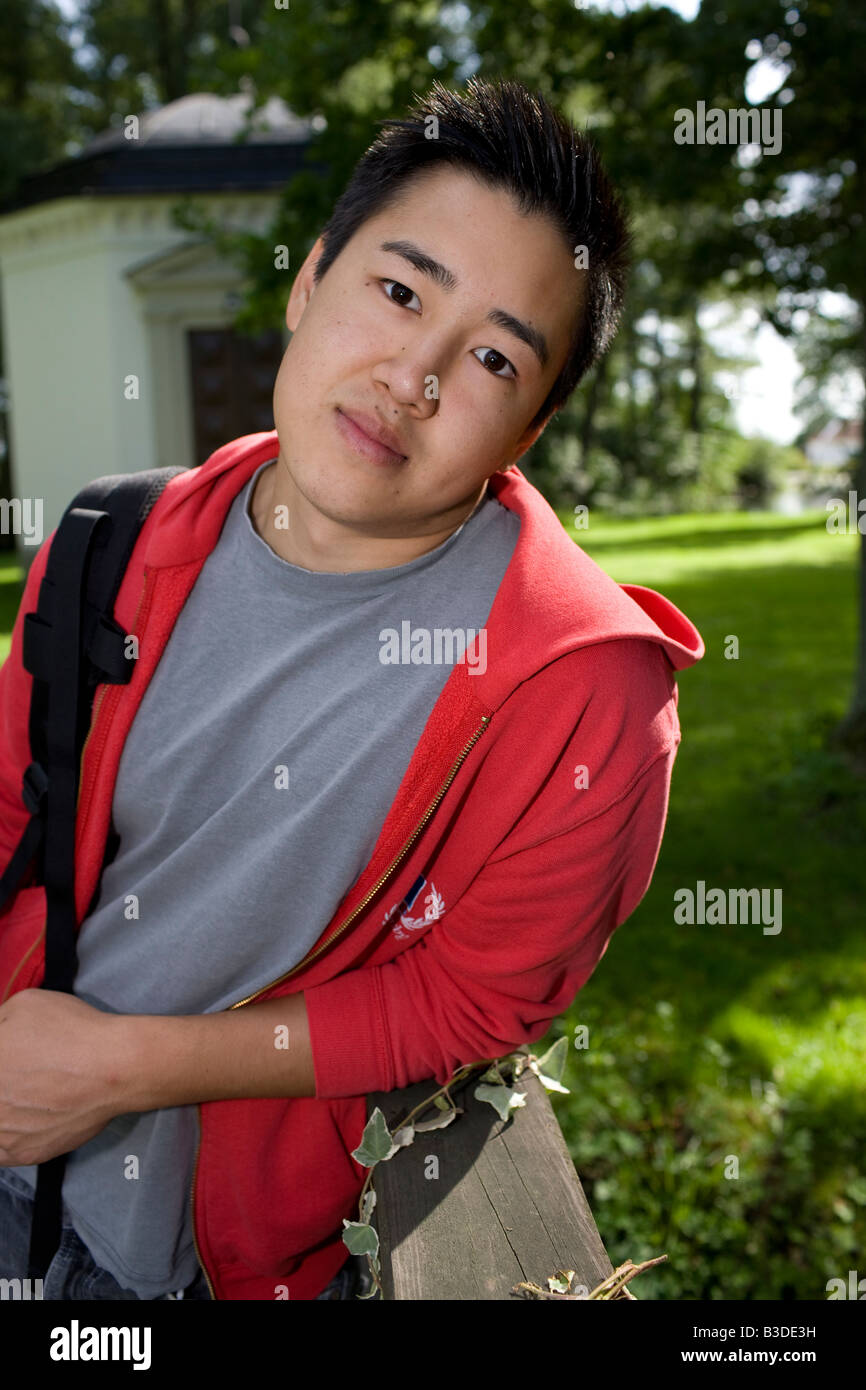 Young man in red jacket Stock Photo - Alamy