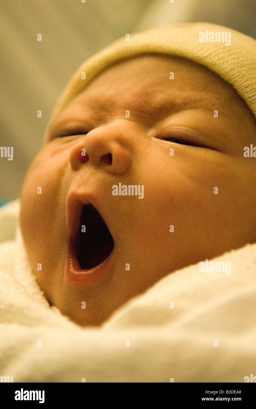 Adorable infant girl yawning Stock Photo - Alamy