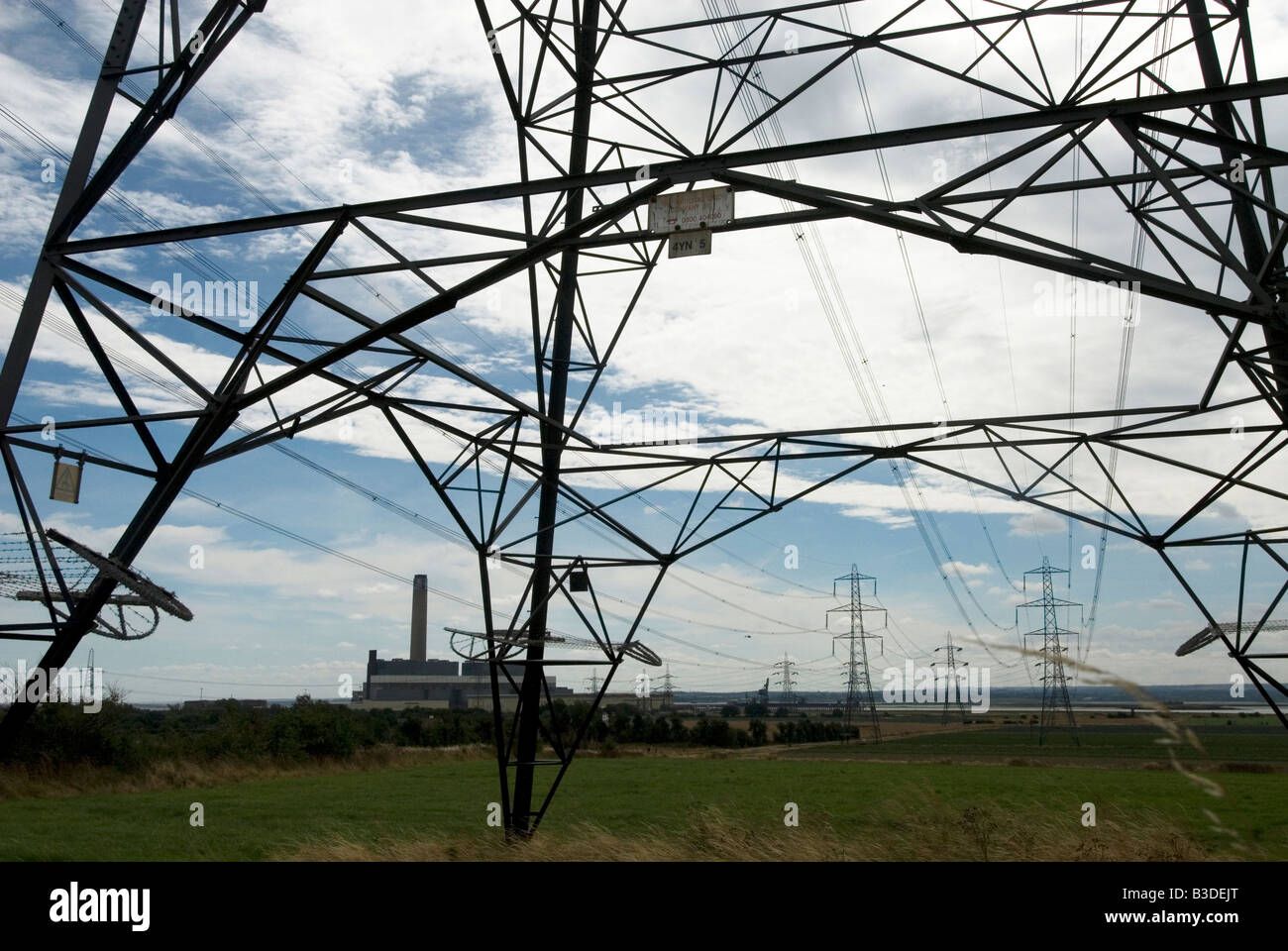 View of the power plant through pylons Stock Photo - Alamy
