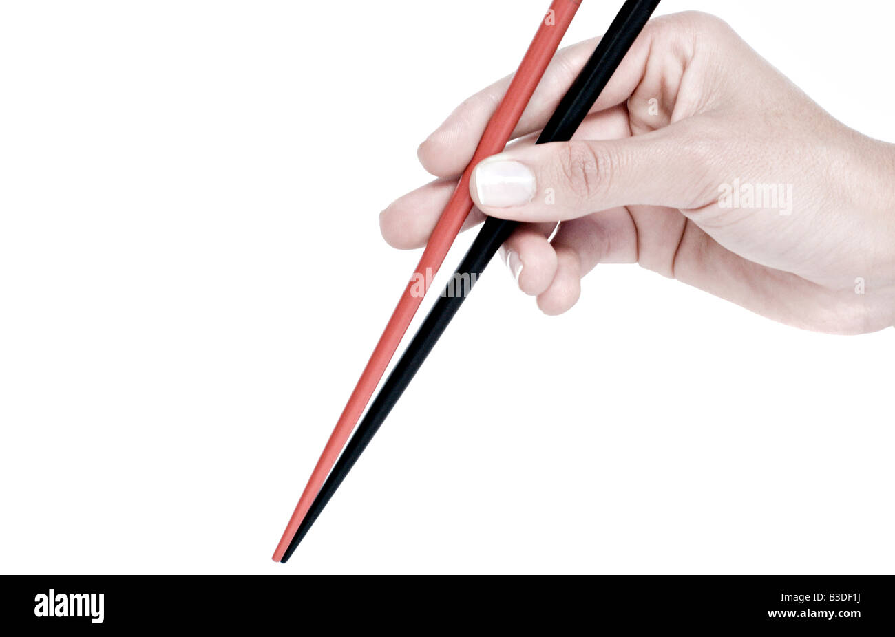 Hand with chopsticks hi-res stock photography and images - Alamy