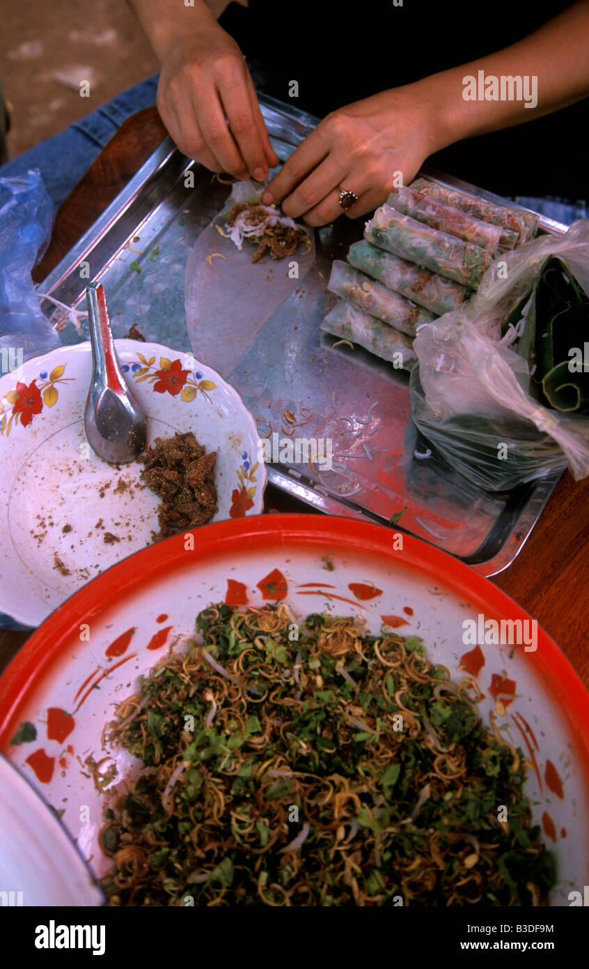 Lao style spring rolls with pungent herbs sesame coated meat pieces are ...