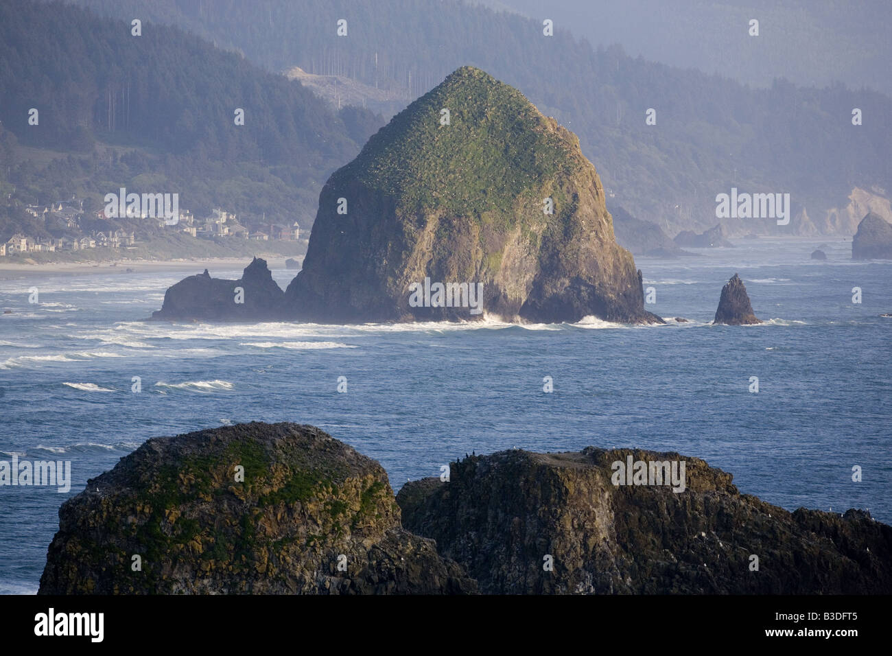 Sunrise and sea stacks on the beach in Cannon Oregon with a dramatic ...