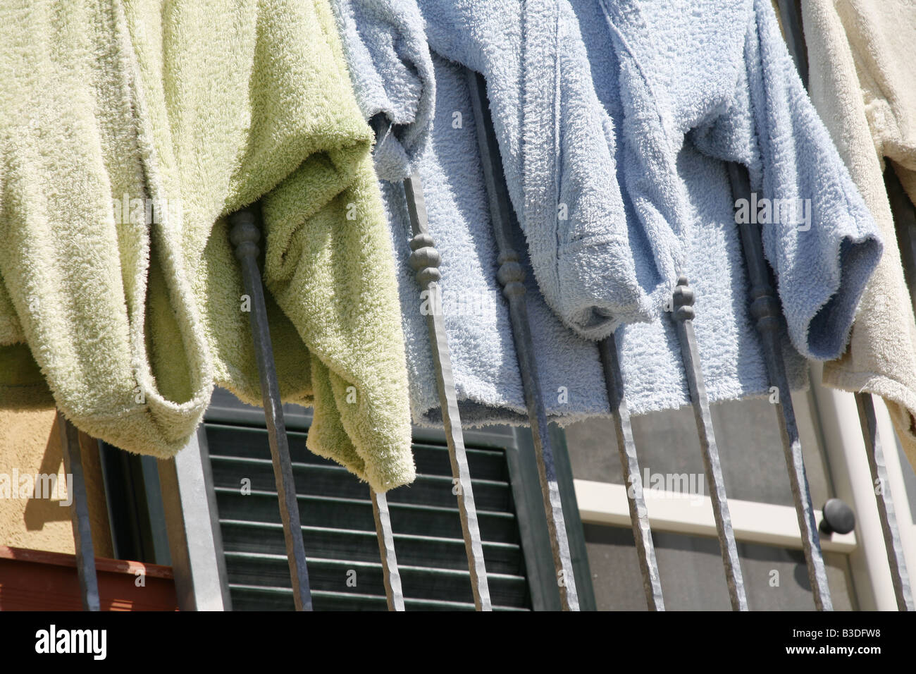 dressing gowns hanging on washing line in sun Stock Photo - Alamy