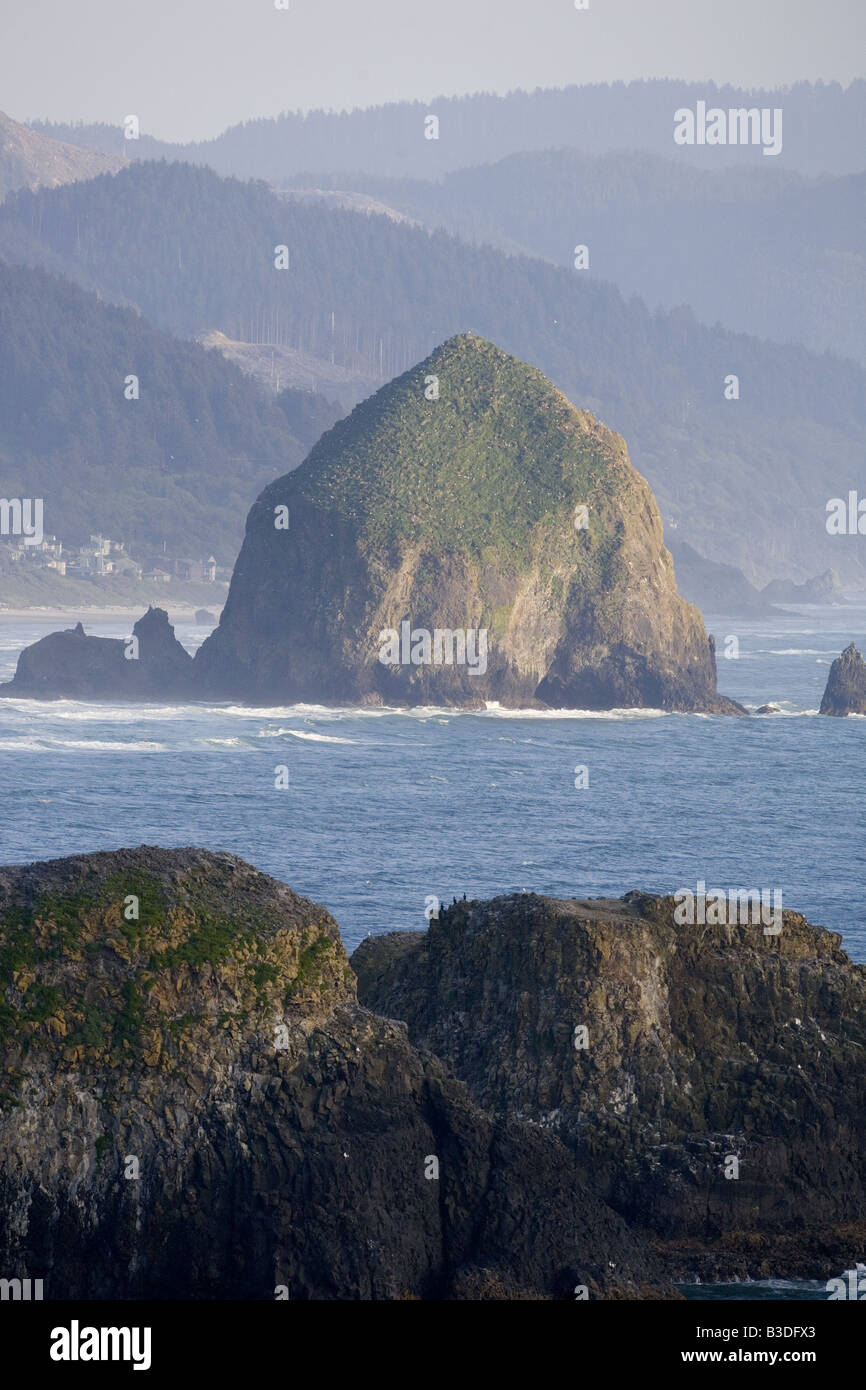 Sunrise and sea stacks on the beach in Cannon Oregon with a dramatic ...