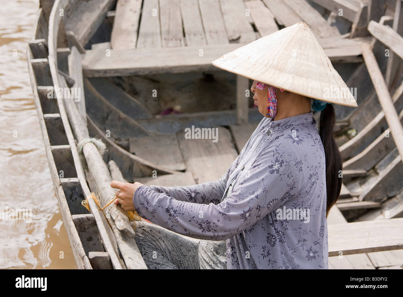A pretty lady trading at one of the floating markets in Vietnam Stock ...