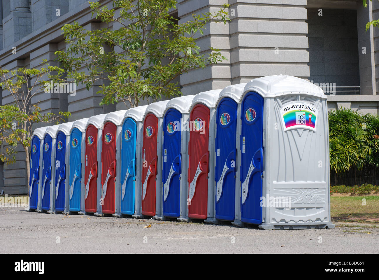 Portable toilets in a row Stock Photo - Alamy