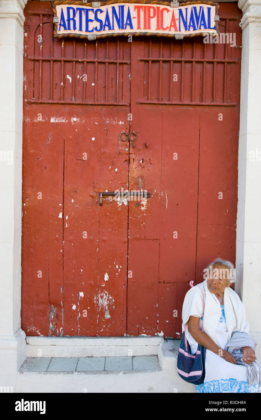 An elderly lady sitting on a stoop in Campeche Mexico Stock Photo - Alamy