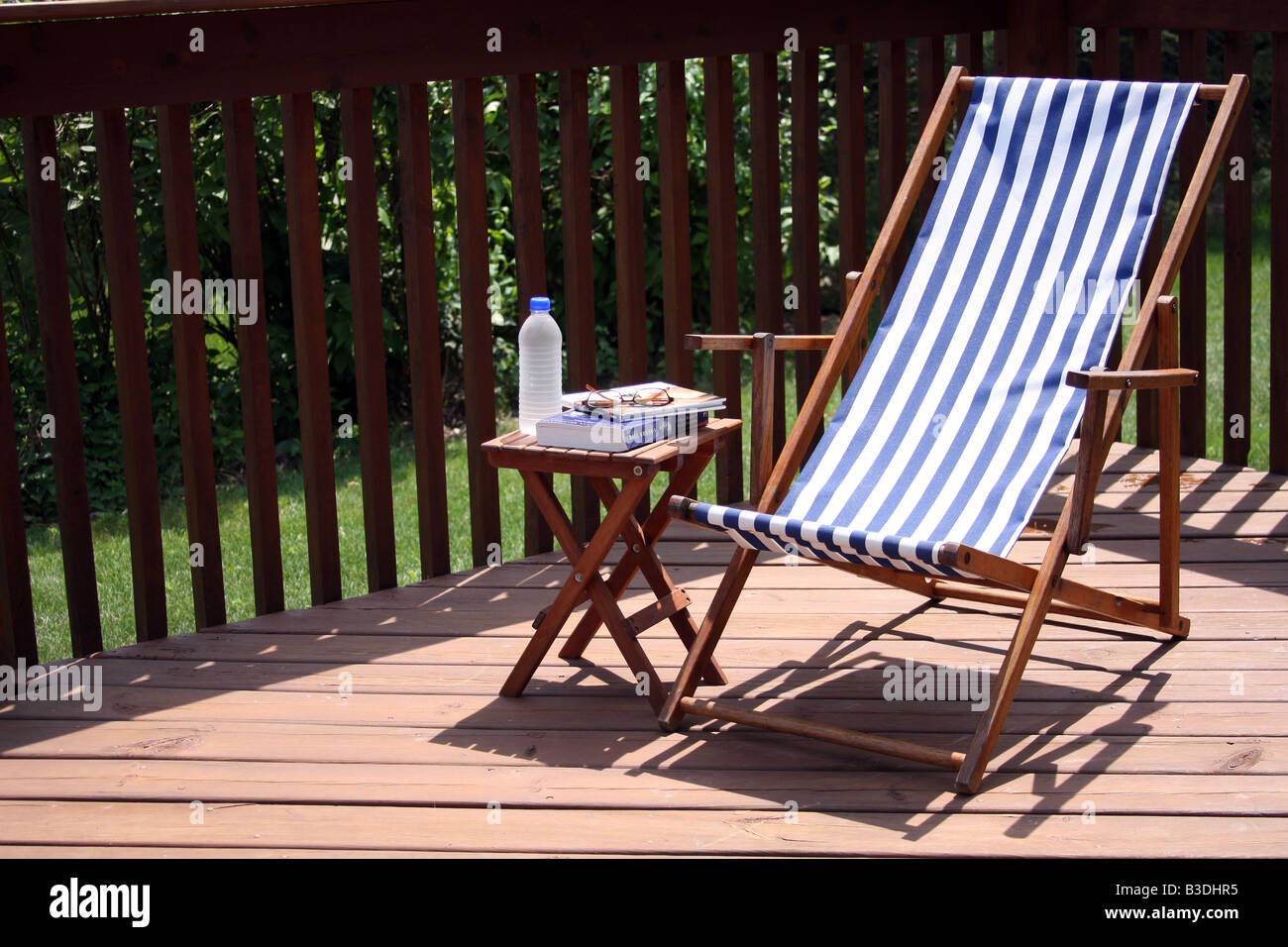 Reading books on the deck in summer Stock Photo - Alamy