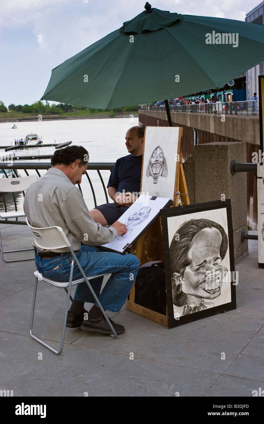 Artist drawing cartoons Montreal Quebec Canada Stock Photo - Alamy