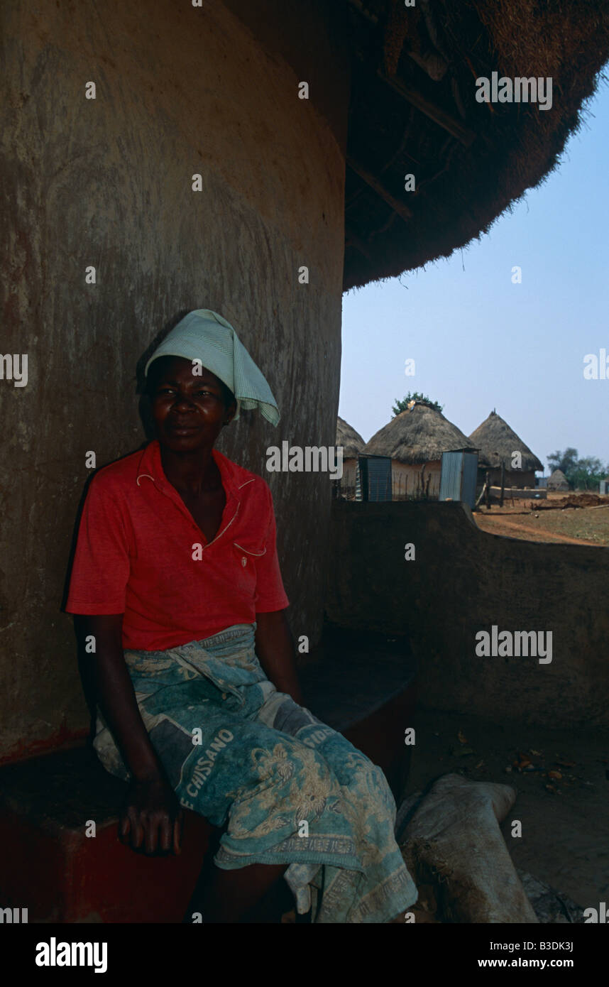 Woman sitting outside her hut in South Africa Stock Photo - Alamy