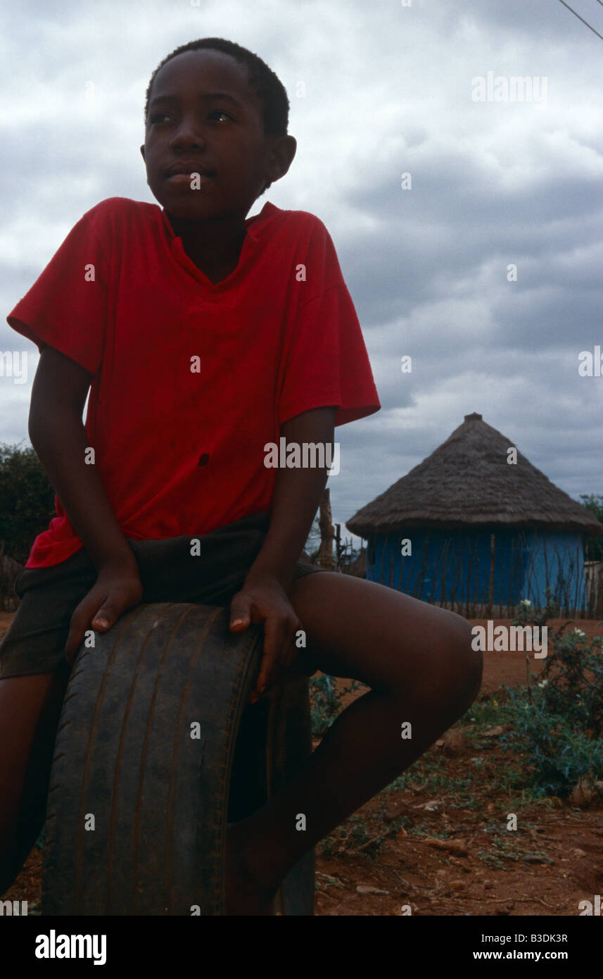 Boy playing with a wheel in South Africa Stock Photo - Alamy