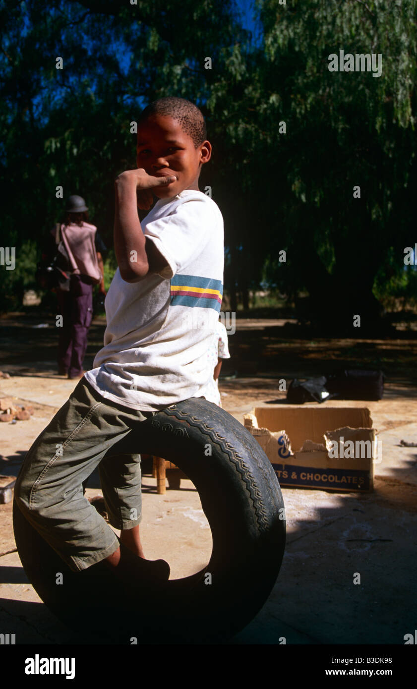 Boy playing with tyre in South Africa Stock Photo - Alamy