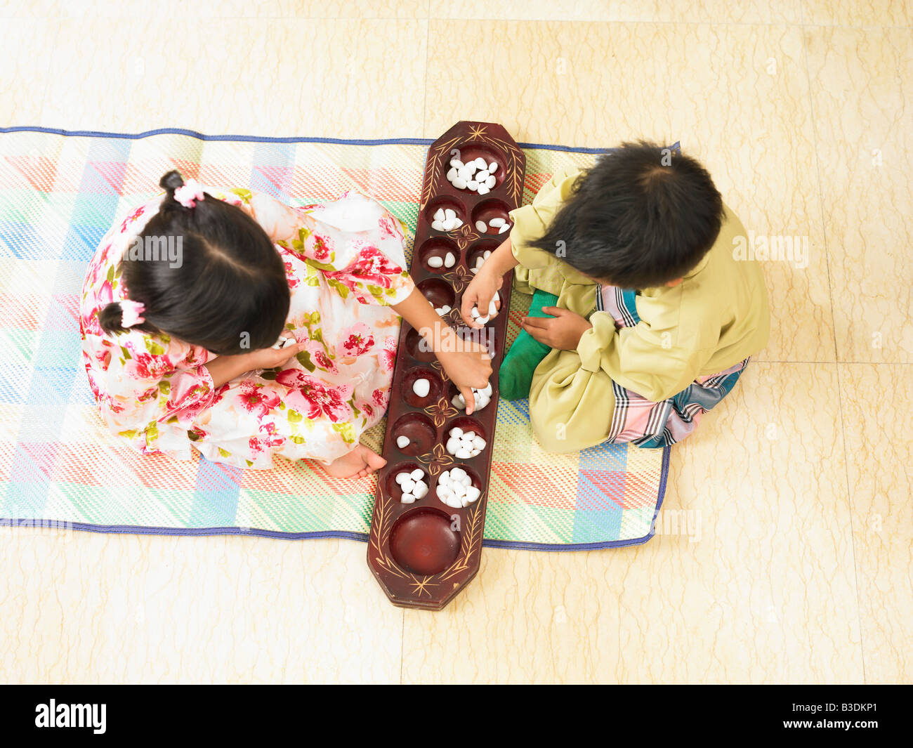Playing traditional game together Stock Photo - Alamy