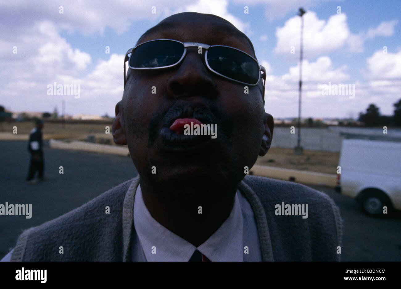 Man poking his tongue at the camera Stock Photo - Alamy