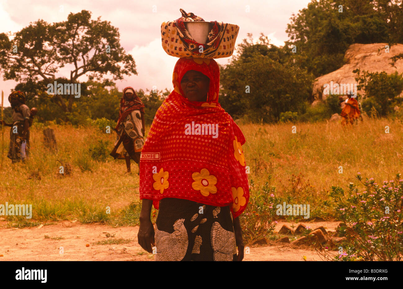 Woman carrying pot in Uganda Stock Photo - Alamy