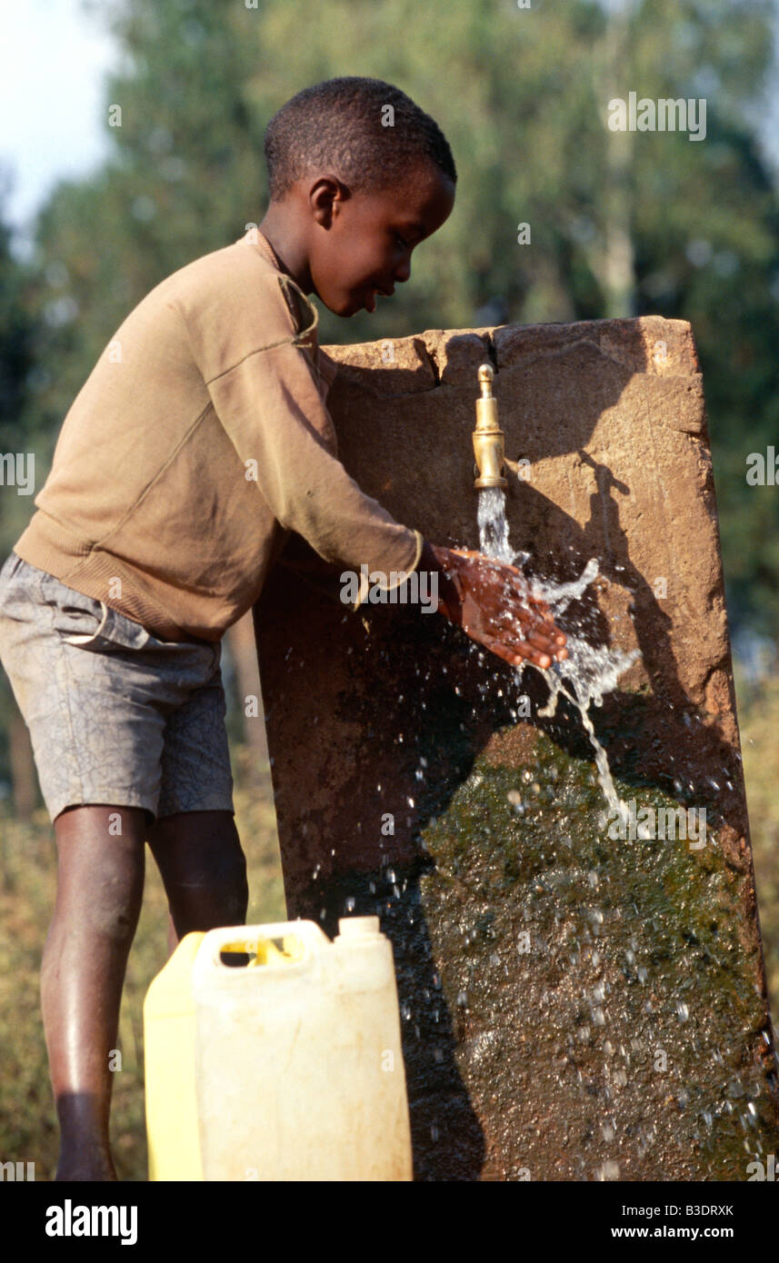 Ugandan Child Fetching Water High Resolution Stock Photography and ...