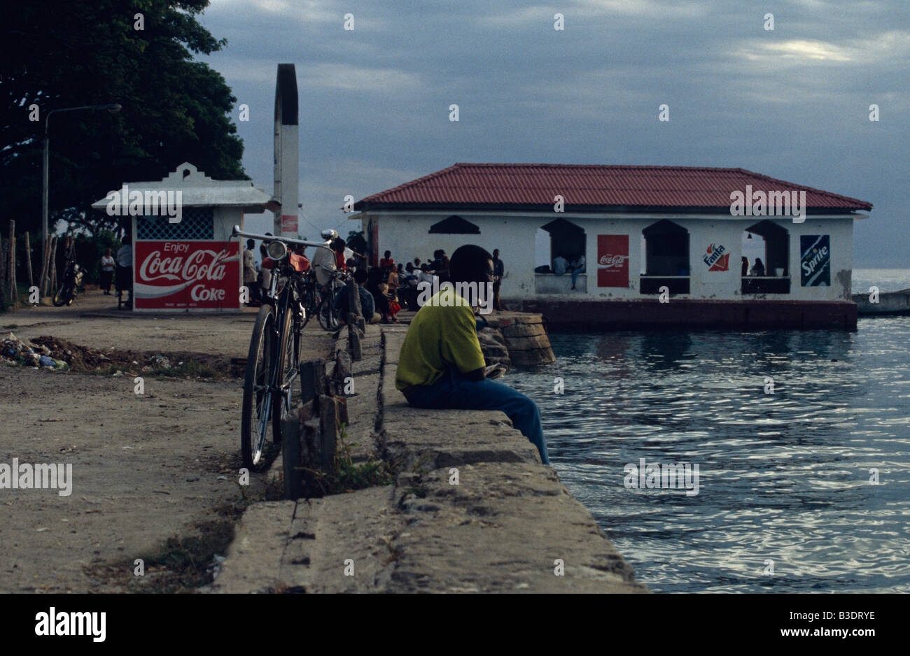 Villagers gathering at pier, Stone Town, Zanzibar Stock Photo - Alamy