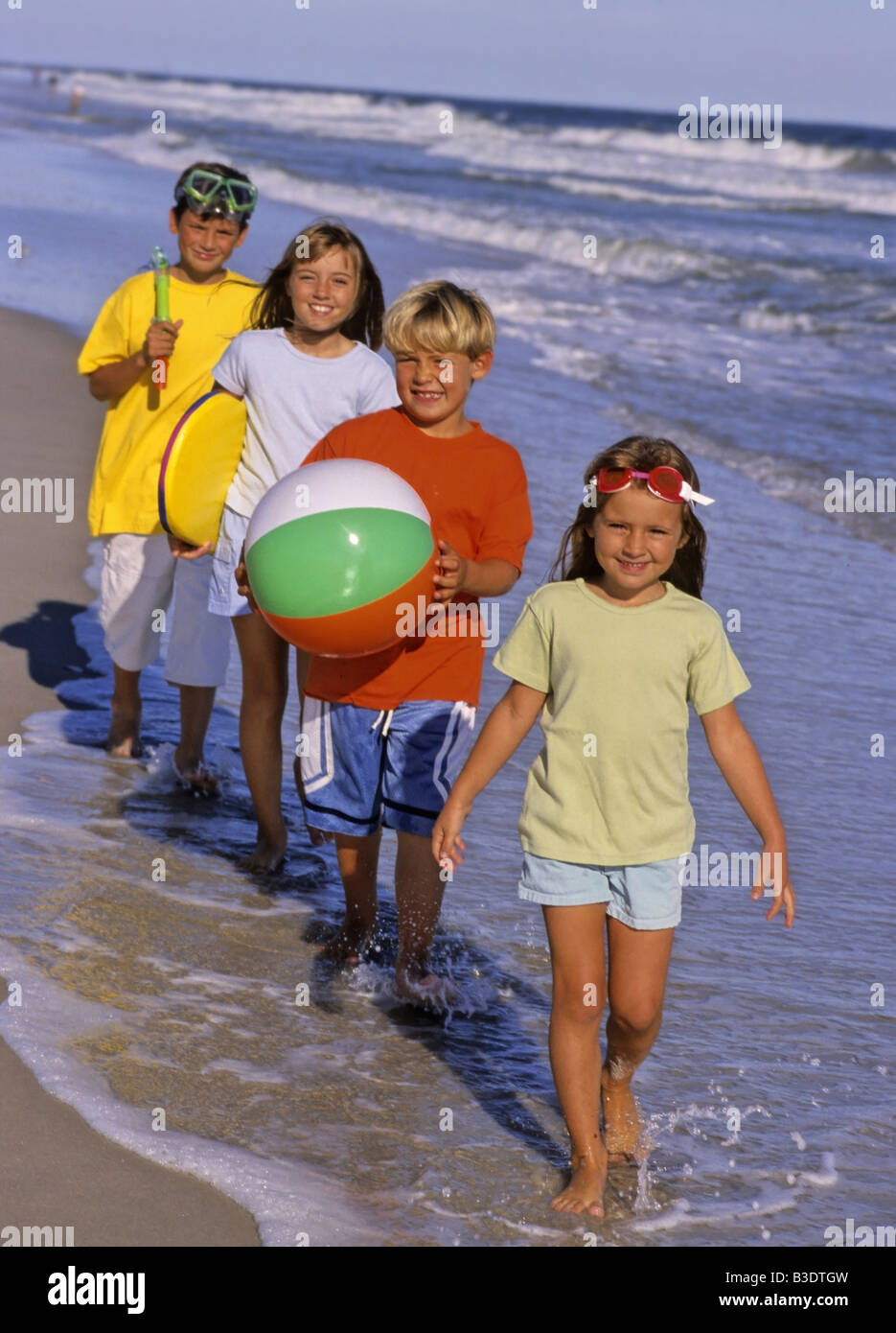 Friends having fun at a beach Stock Photo - Alamy