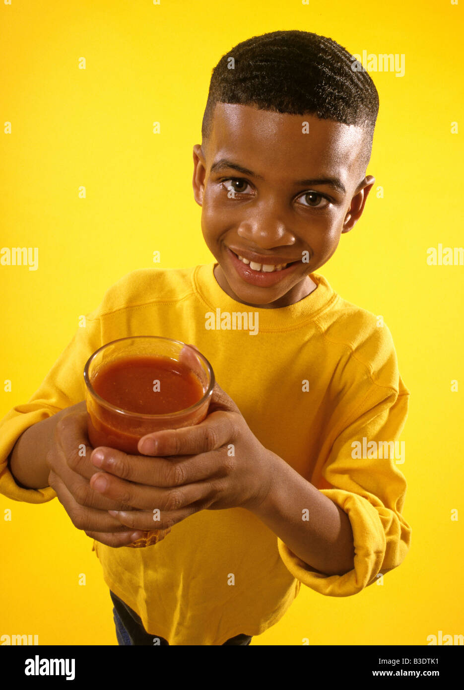 Boy with tomato juice Stock Photo - Alamy