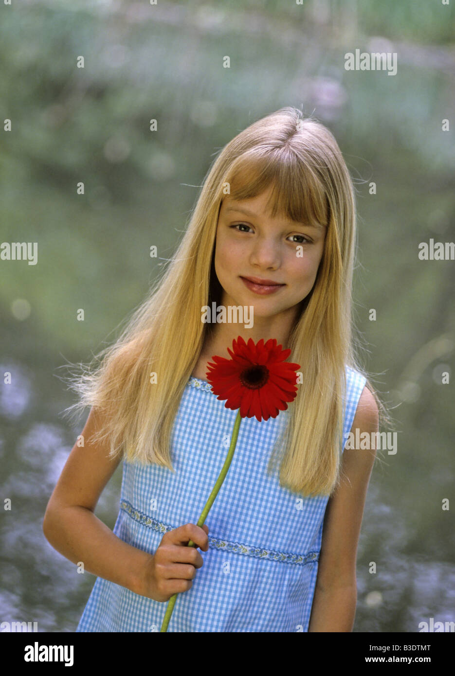 Girl with red rose Stock Photo - Alamy