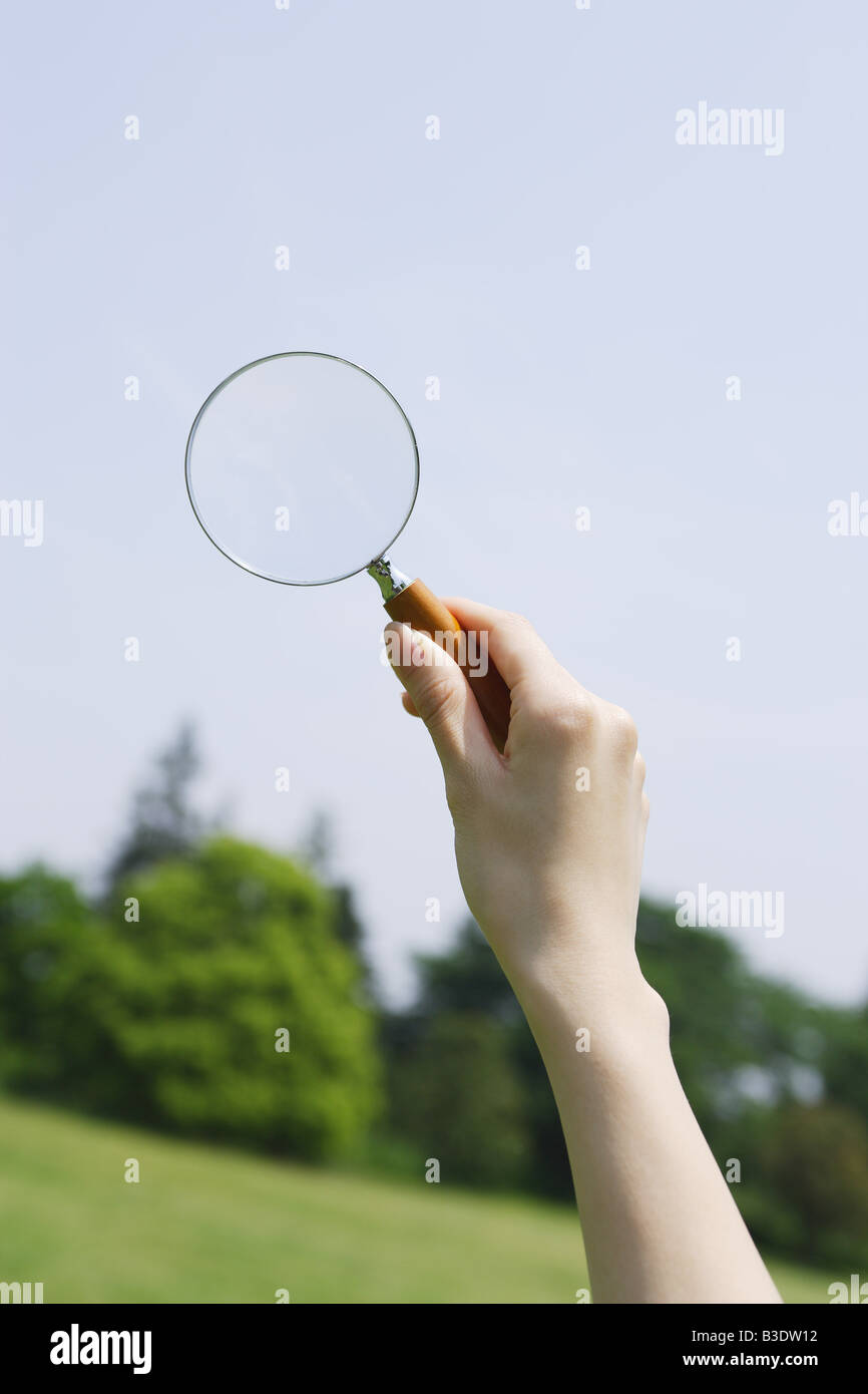 Hold magnifying glass hi-res stock photography and images - Alamy